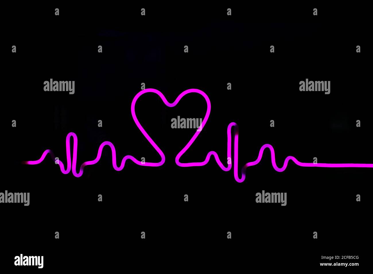 Neon heart display on the window of a store Stock Photo - Alamy
