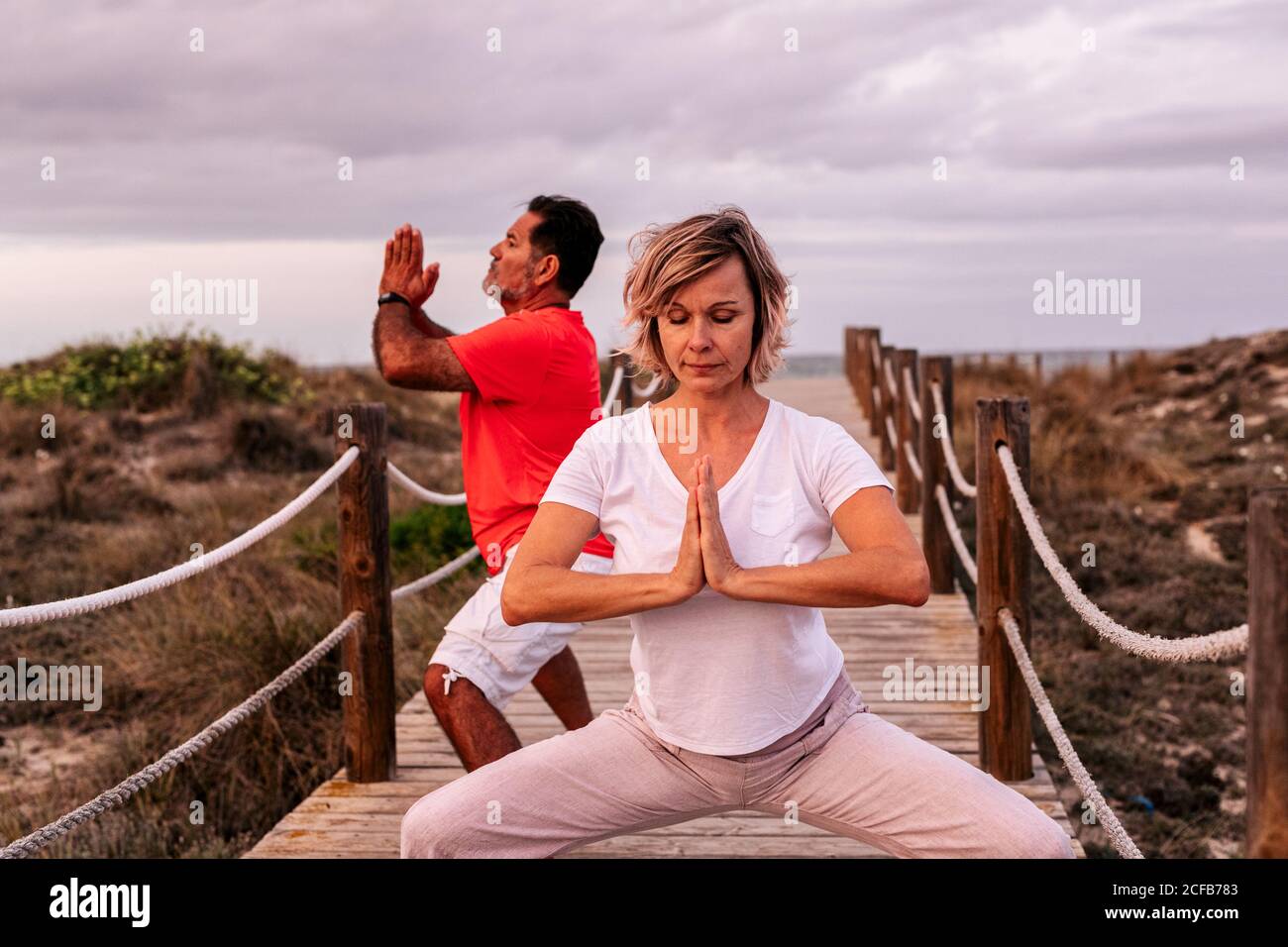 Couple meditating hi-res stock photography and images - Alamy