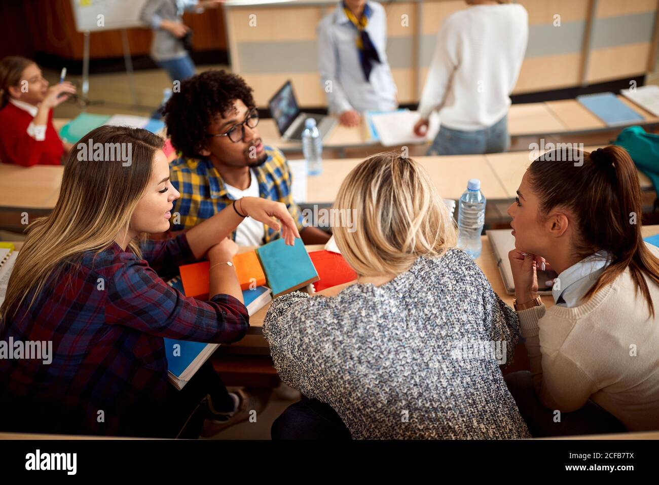 Group of young people talking in the amphitheater Stock Photo - Alamy