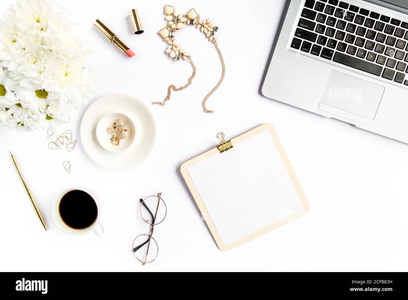 Women's stylish table desk. Workspace with computer, coffee and ...