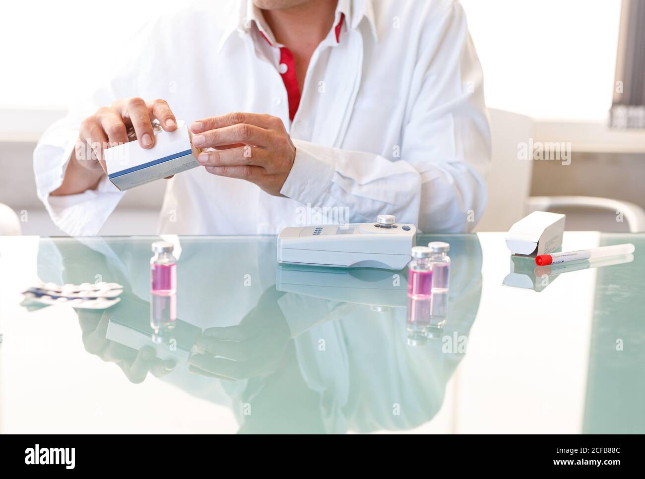Medical worker making tests with pills and samples in lab Stock Photo ...