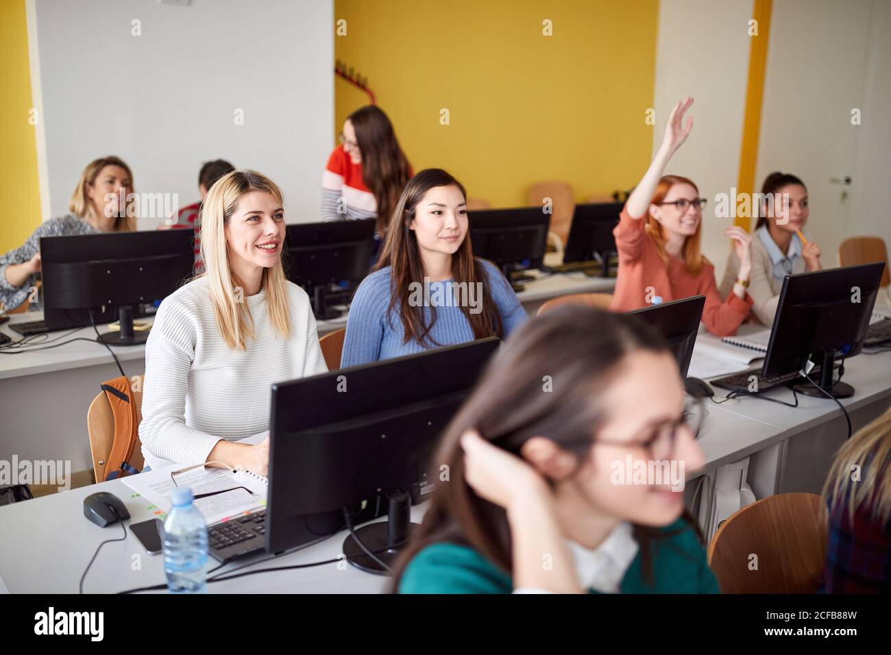 Young girls in classroom on lecture Stock Photo - Alamy