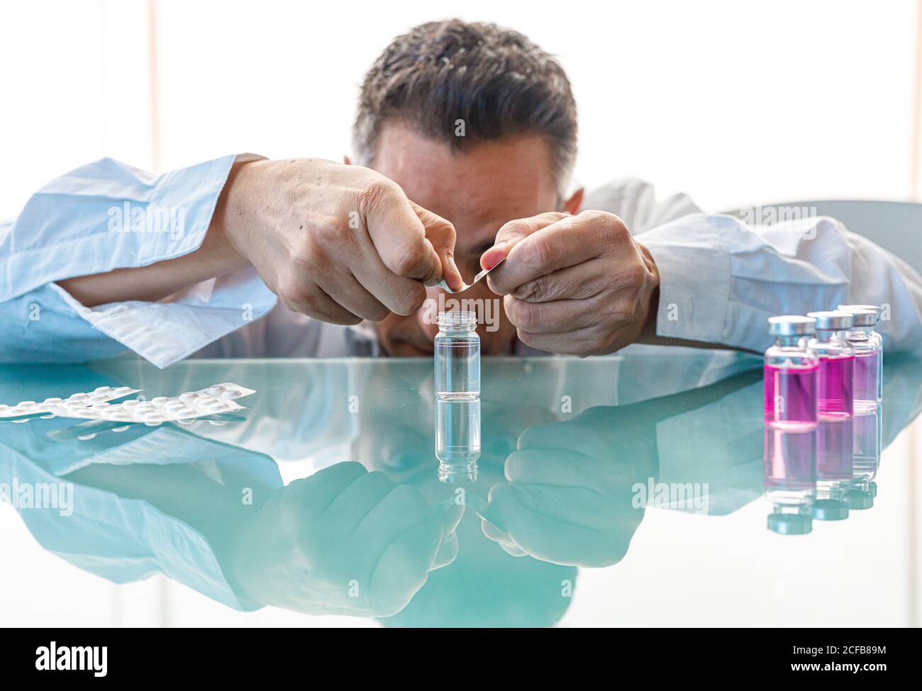 Assistant making test with samples in laboratory Stock Photo - Alamy