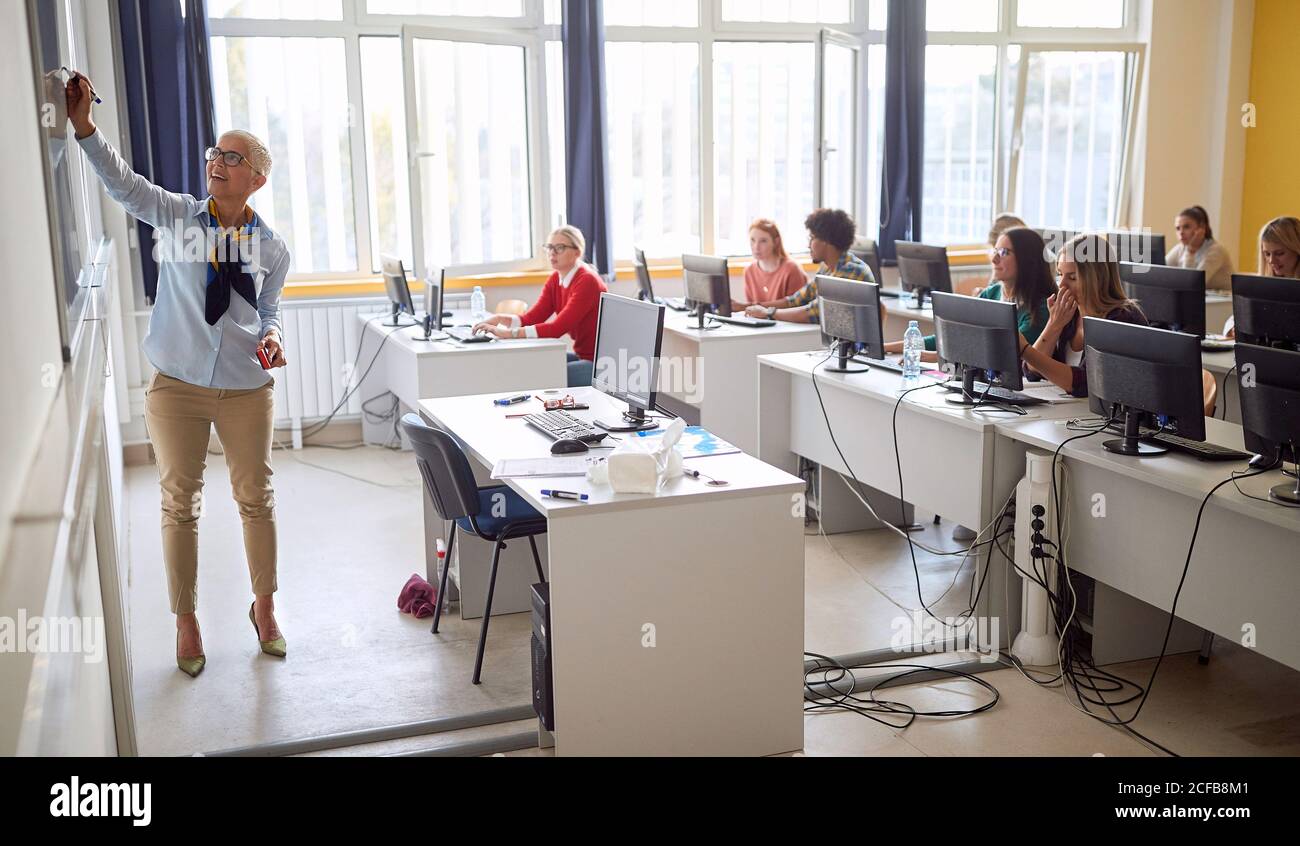 Female professor with board hi-res stock photography and images - Alamy