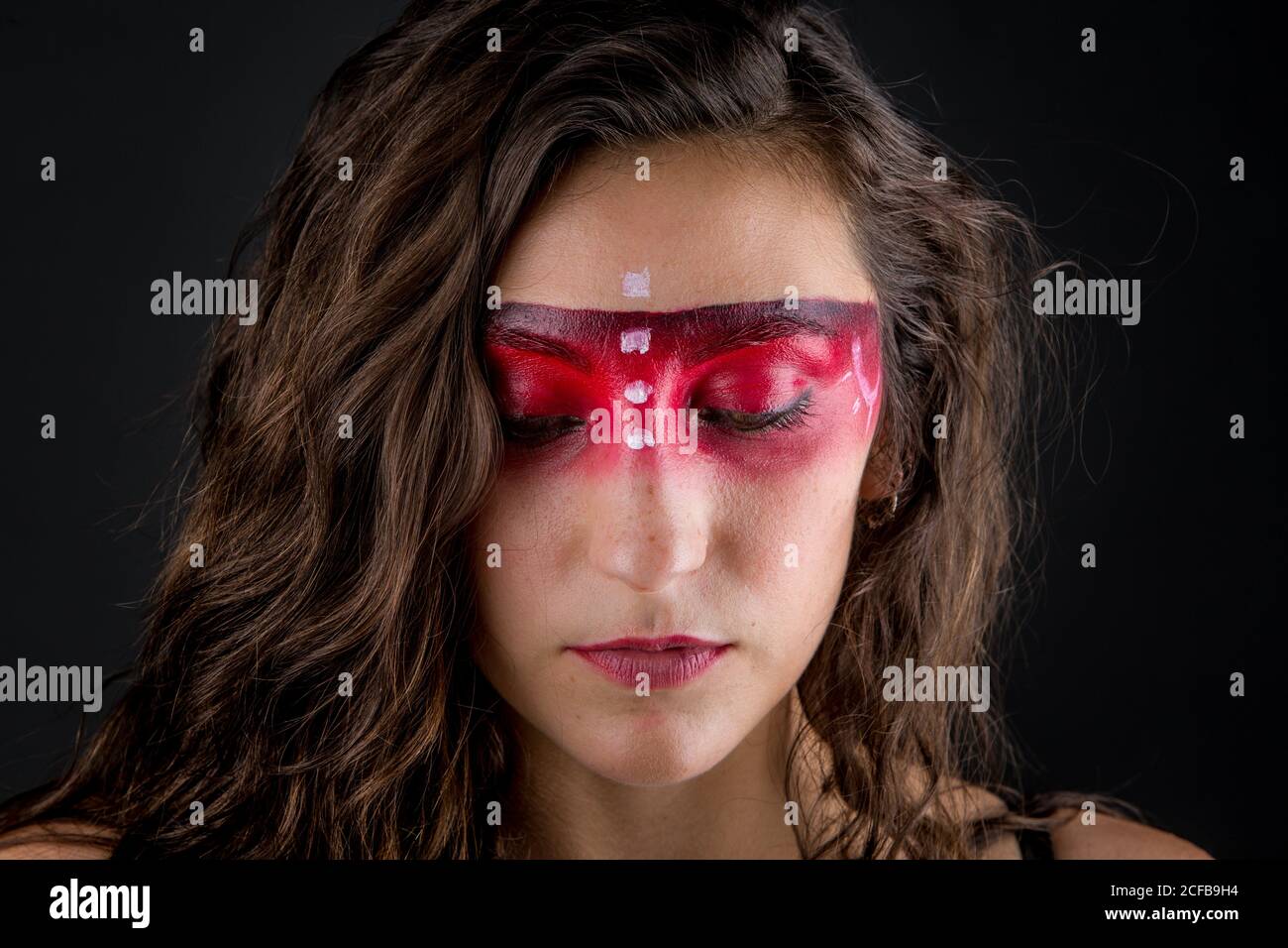 Beautiful model with painted face Stock Photo - Alamy