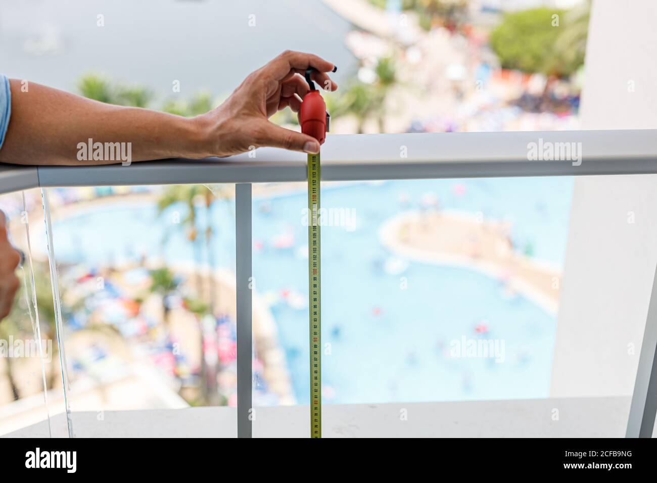 Safety inspector checking balcony railing Stock Photo - Alamy