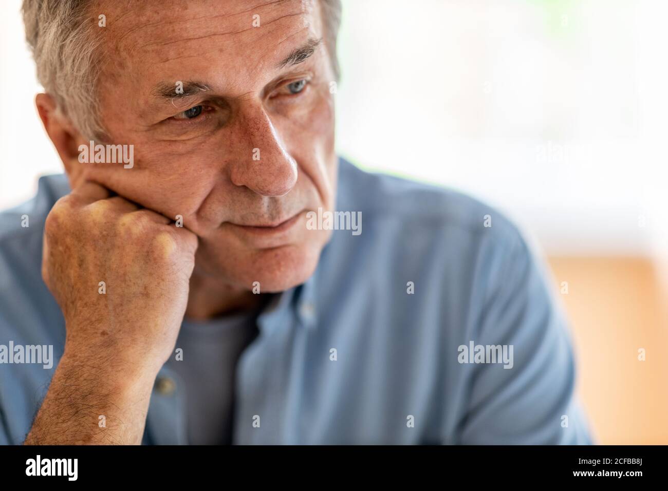 Portrait of senior man looking depressed Stock Photo - Alamy