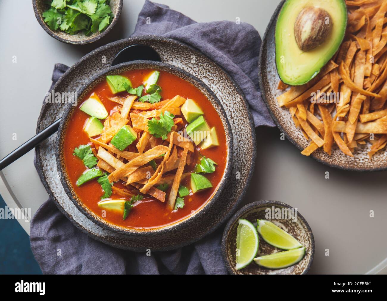 Mexican style table with spicy aztec soup with fried tortilla. Sopa ...