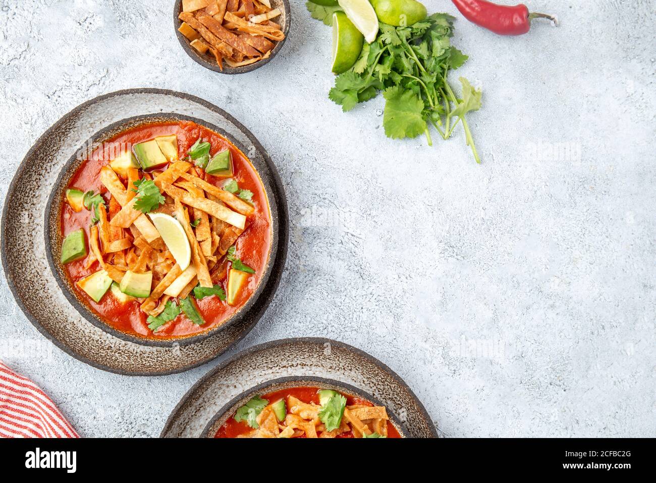 Aztec soup. Mexican sopa azteca with fried tortilla . Top view Stock ...