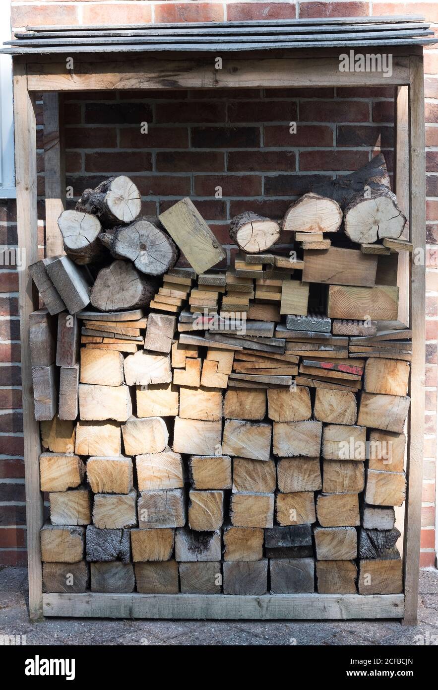 Log burner with log pile hi-res stock photography and images - Alamy