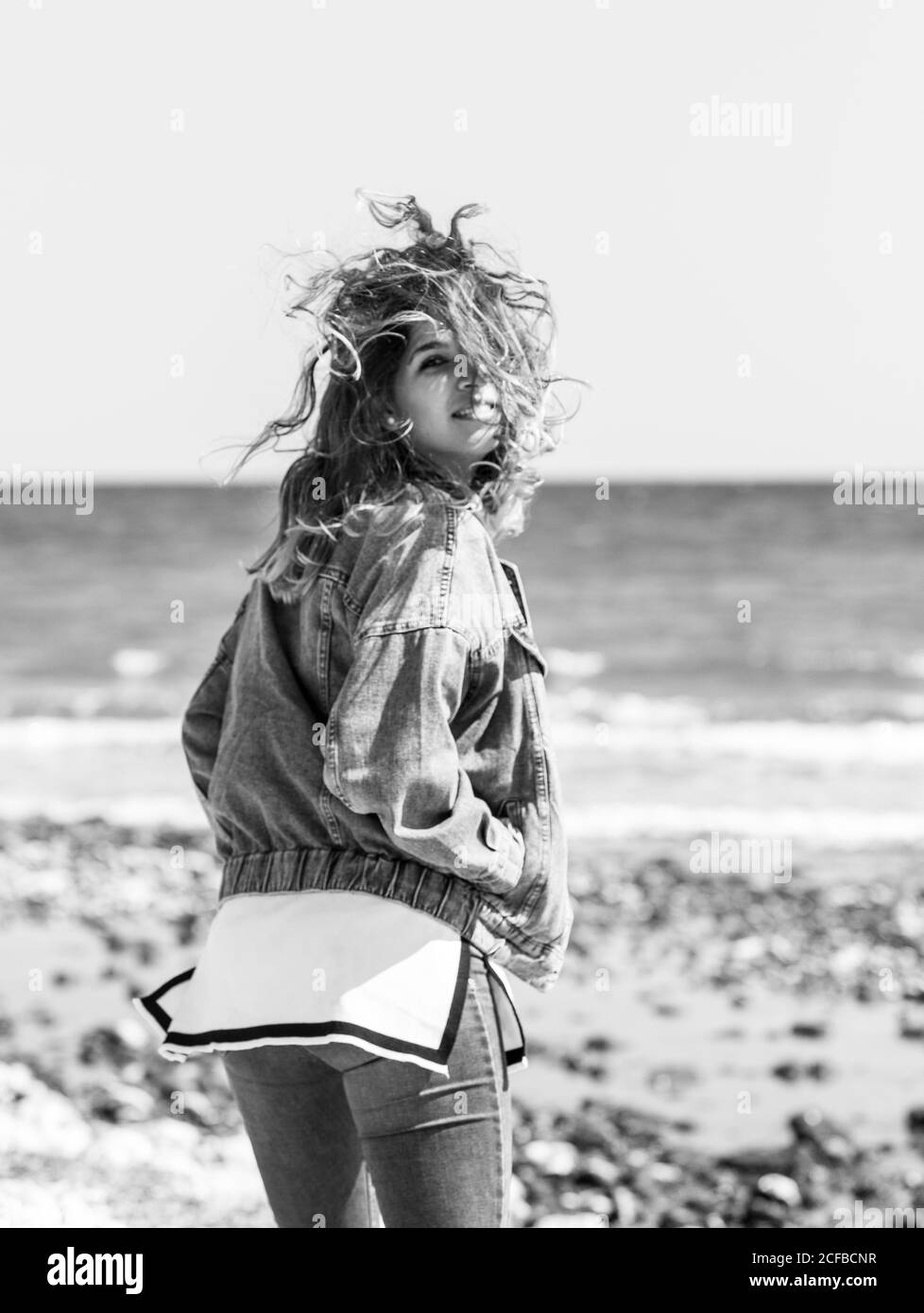 Woman looking back at camera Black and White Stock Photos & Images - Alamy