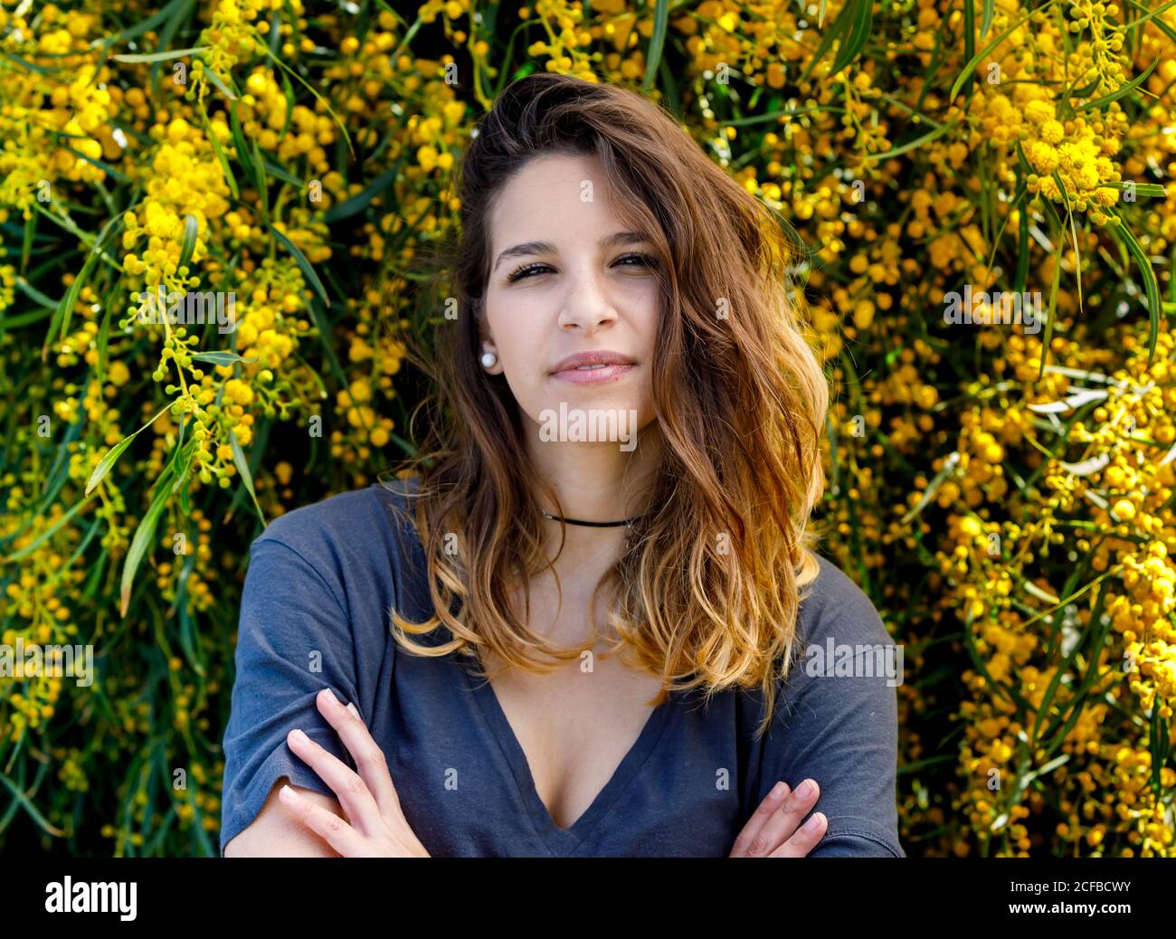 Young female near blooming bushes Stock Photo - Alamy
