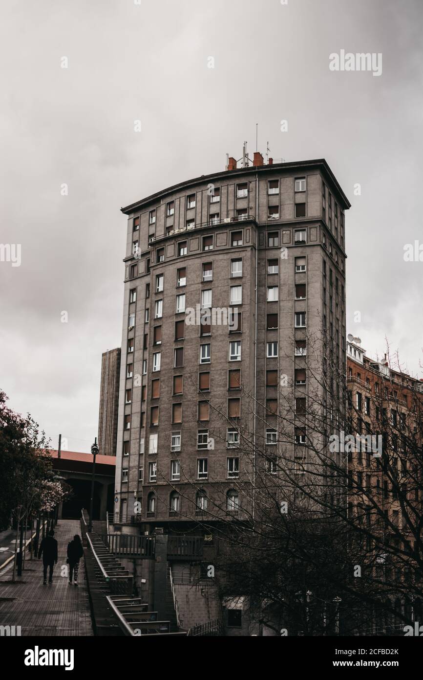 Cloudy sky over buildings Stock Photo - Alamy