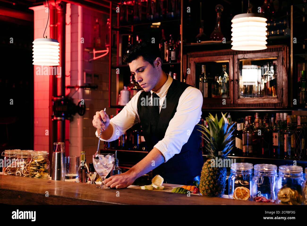 Bartender behind the bar preparing drinks hi-res stock photography and ...