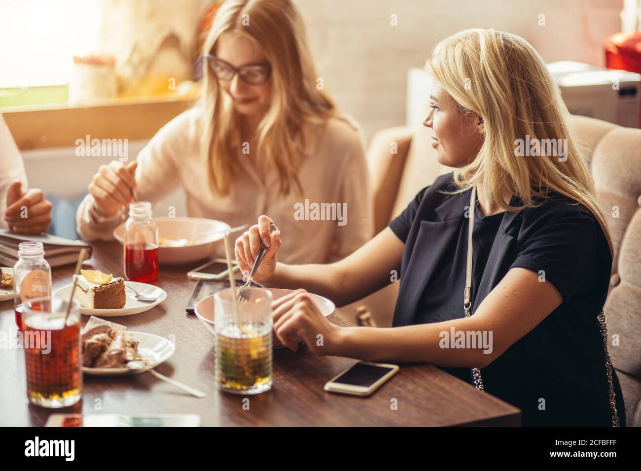 Group of happy business people eating together in restaurant Stock ...