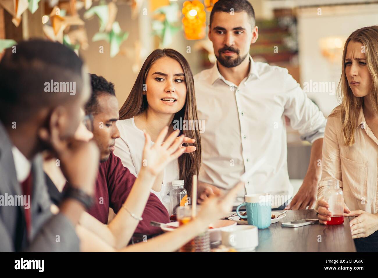 Restaurant counter food community happy hi-res stock photography and ...