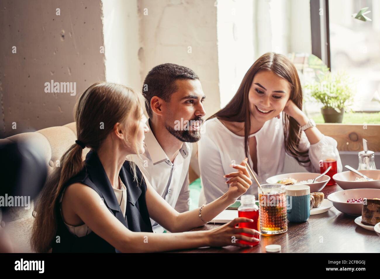 Business Colleagues Eating Meal Together and Discussing of Work Stock ...