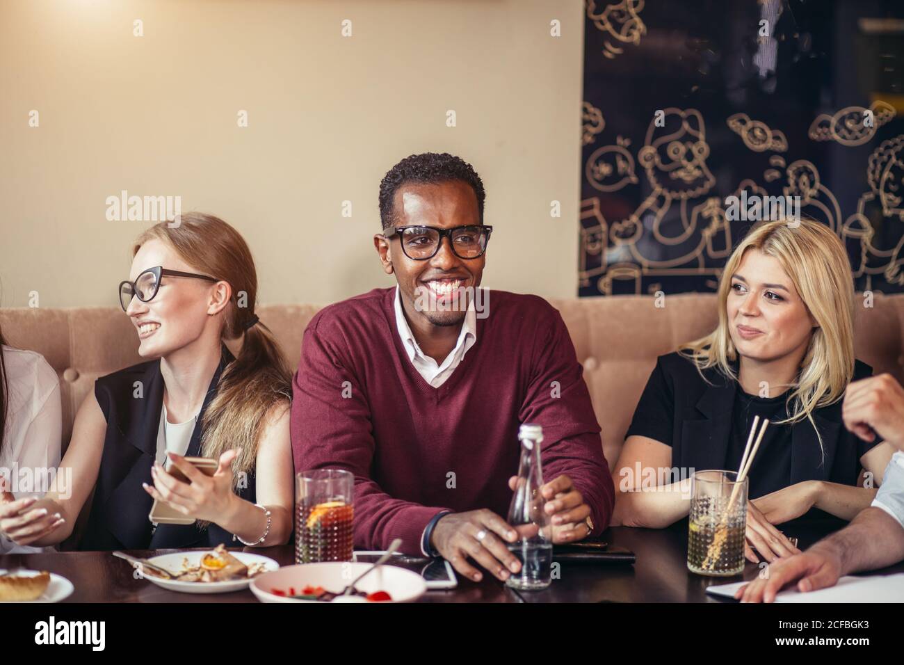 business people meeting in modern restaurant, colleagues having dinner ...
