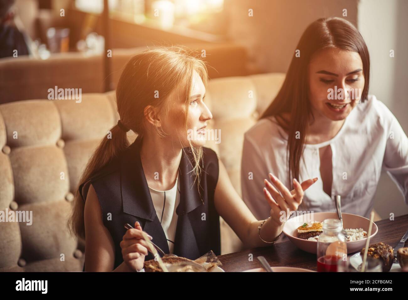 Business Colleagues Eating Meal Together and Discussing of Work Stock ...