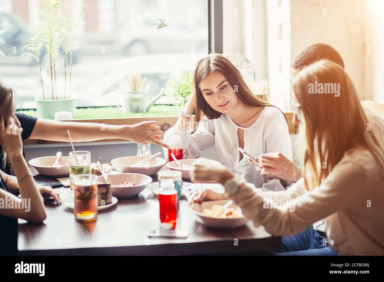 Casual business team eating together in the office Stock Photo - Alamy