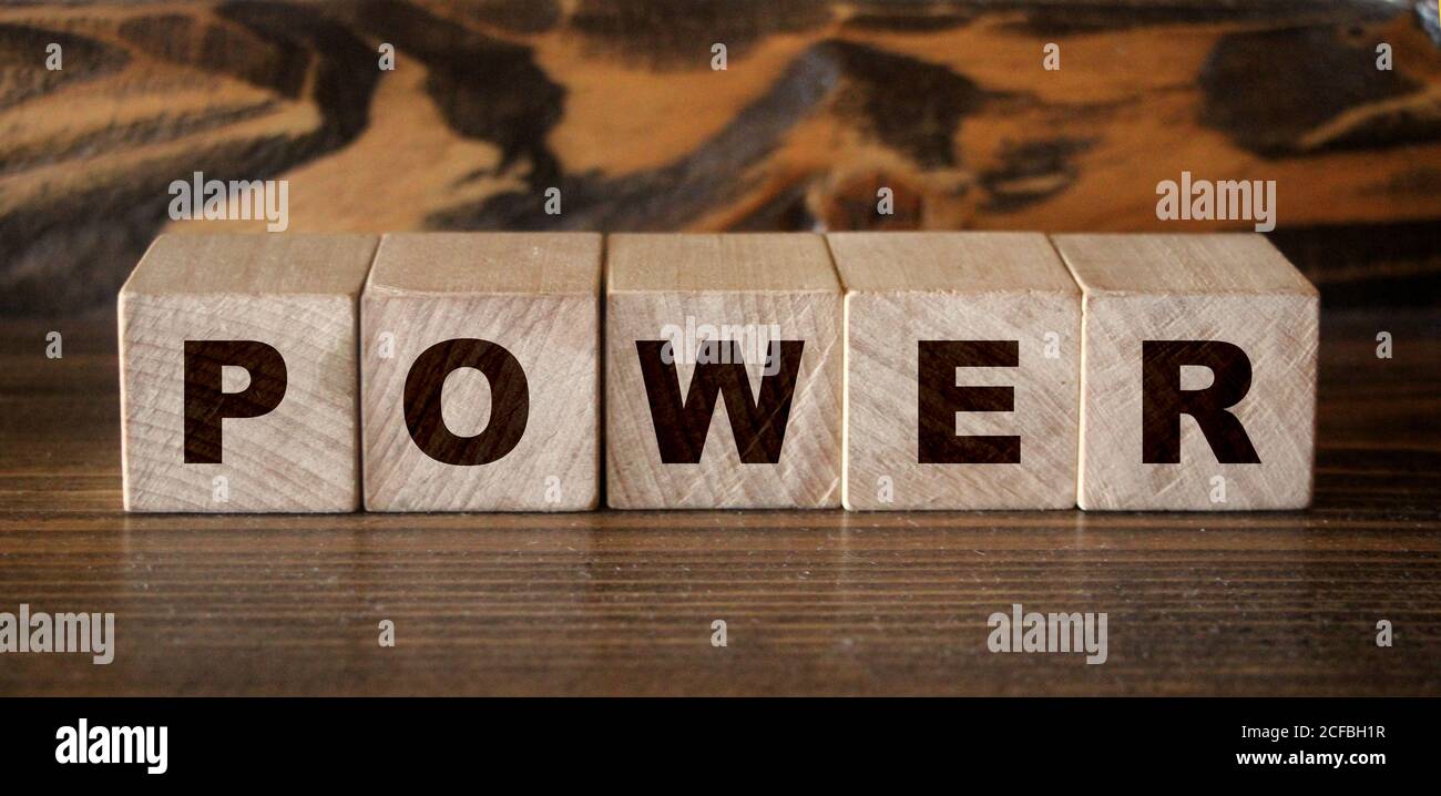 Concept word forming on wooden cube on white background - power Stock ...