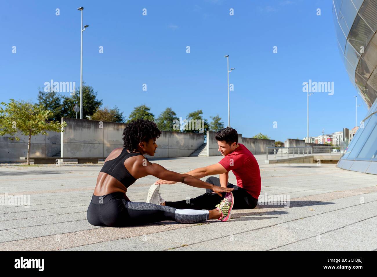 African woman sitting forward side view hi-res stock photography and ...