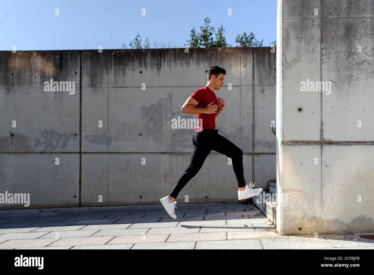 Black man running up stairs hi-res stock photography and images - Alamy