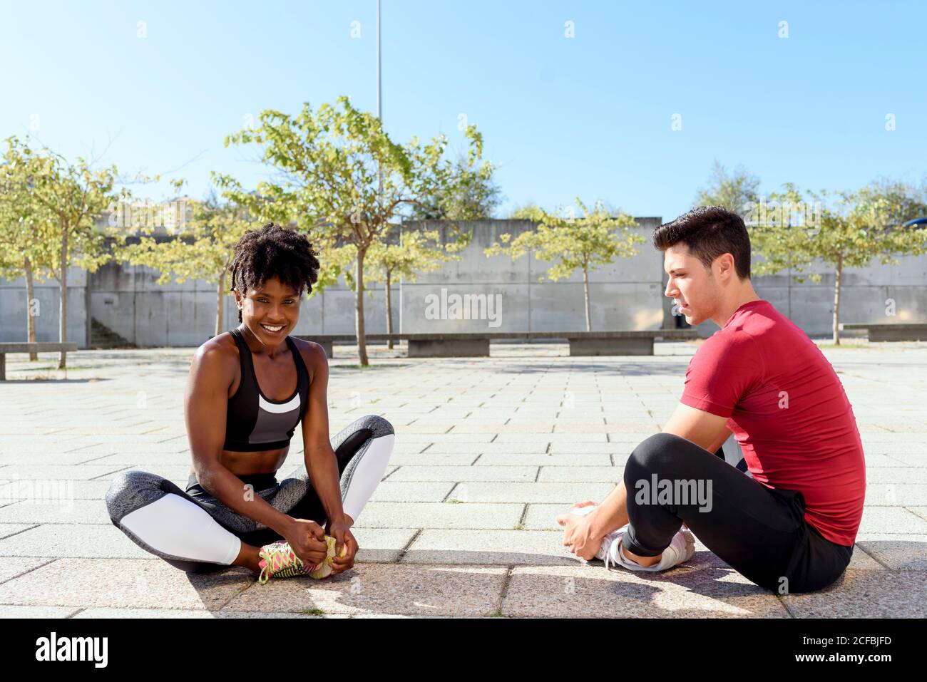 African woman sitting forward side view hi-res stock photography and ...