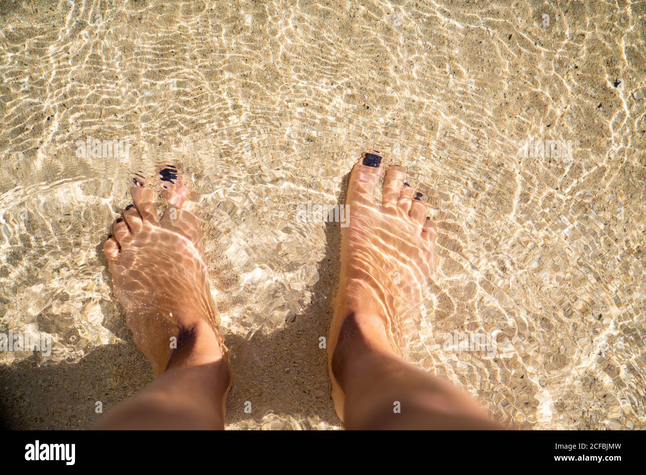 Feet in clear water hi-res stock photography and images - Alamy