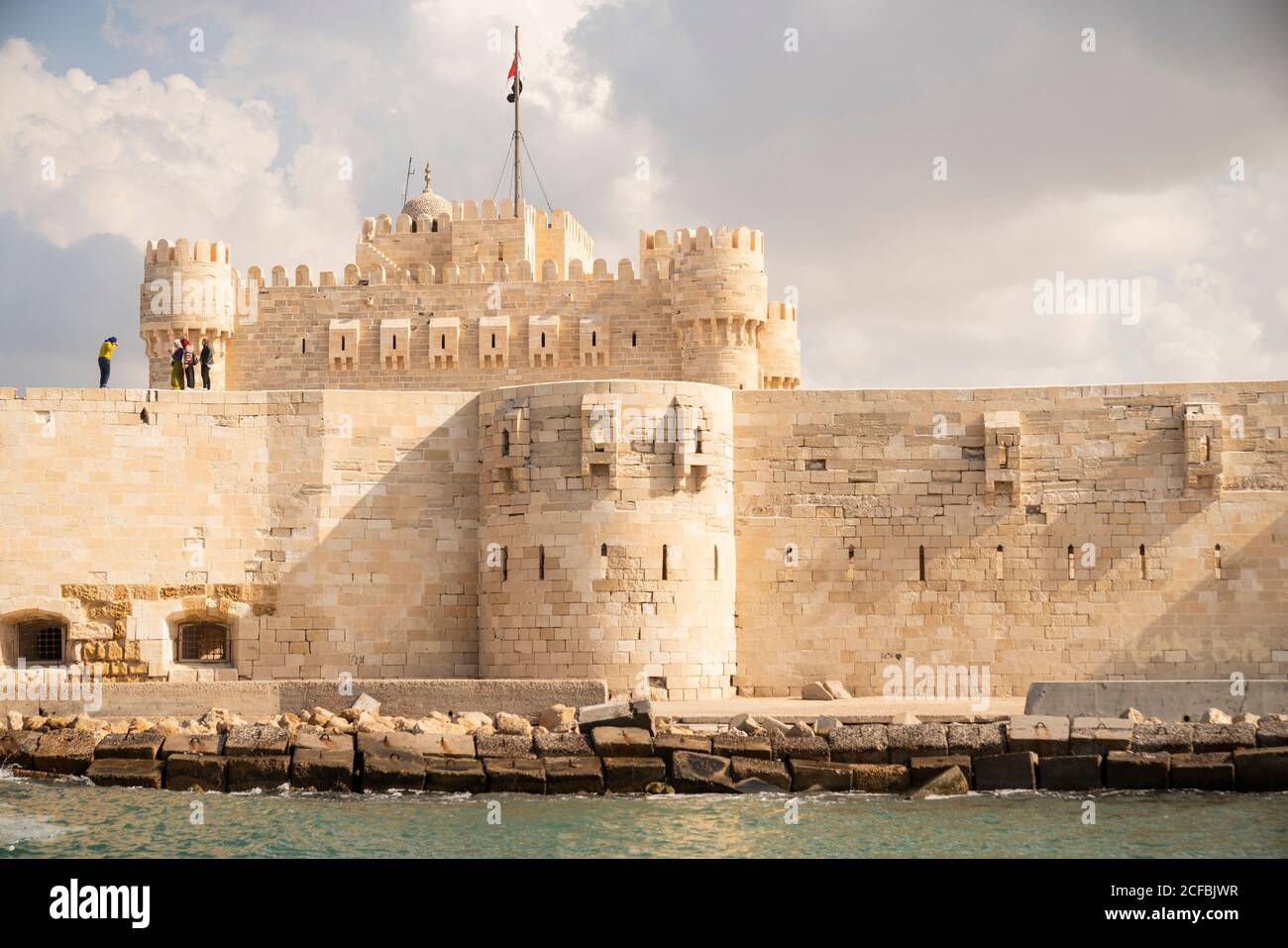 A castle surrounded by a fortress wall in Alexandria, Egypt Stock Photo ...