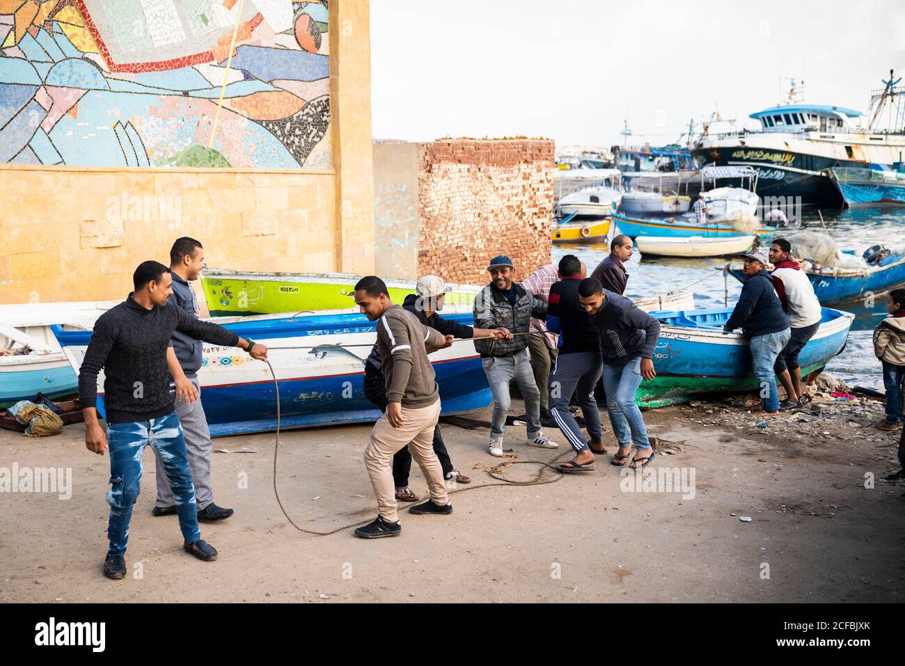 People working together on boat hi-res stock photography and images - Alamy