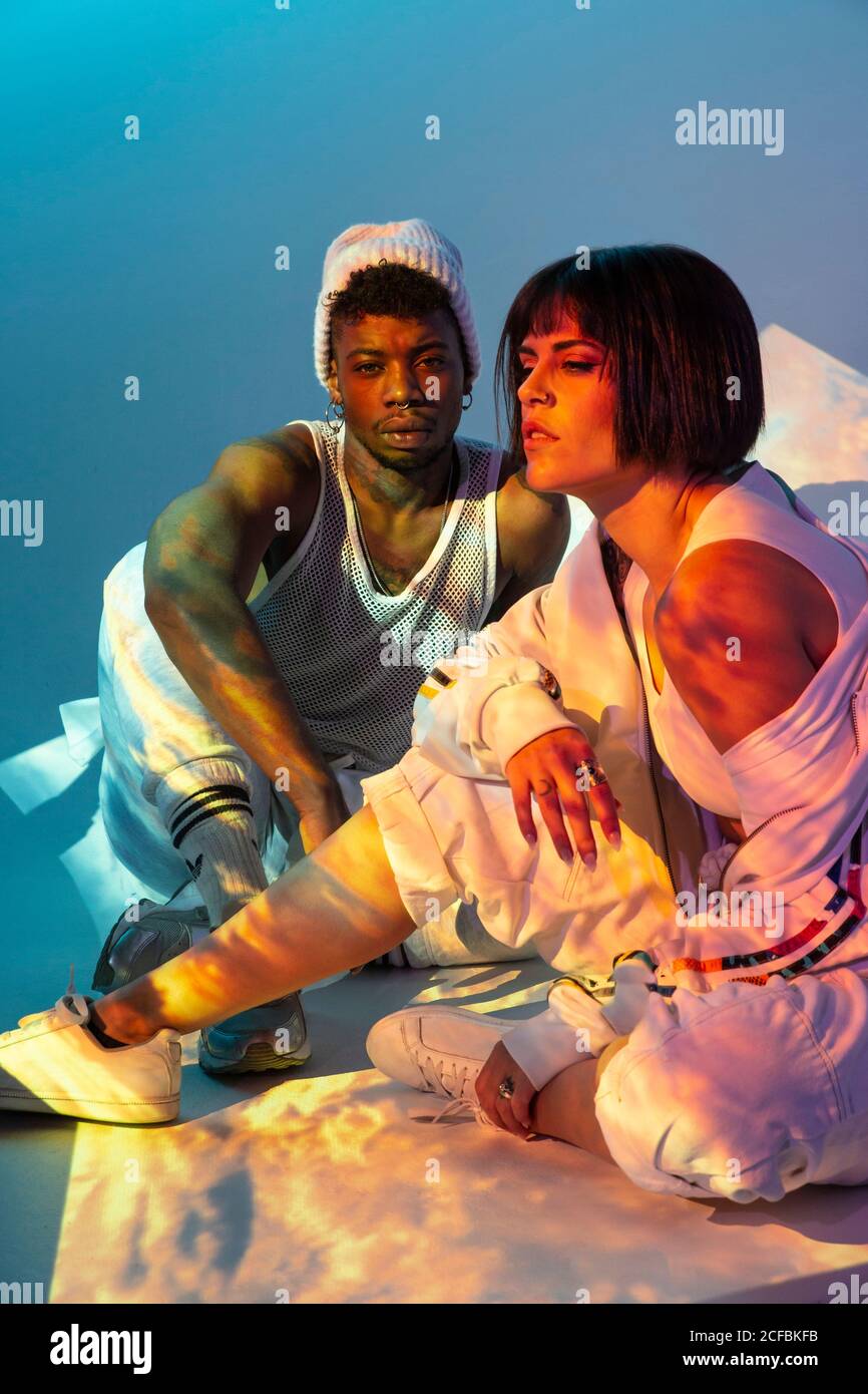 Dancers under violet illumination Stock Photo - Alamy