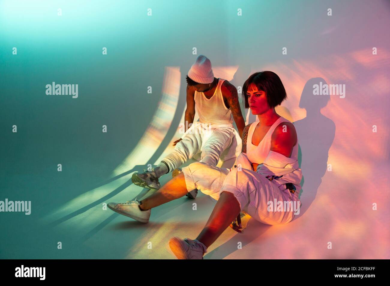 Dancers under violet illumination Stock Photo - Alamy