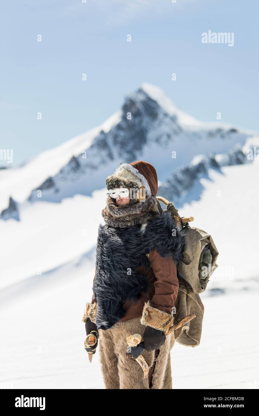 First Nations mountaineer exploring high altitudes, fur clothing Stock ...
