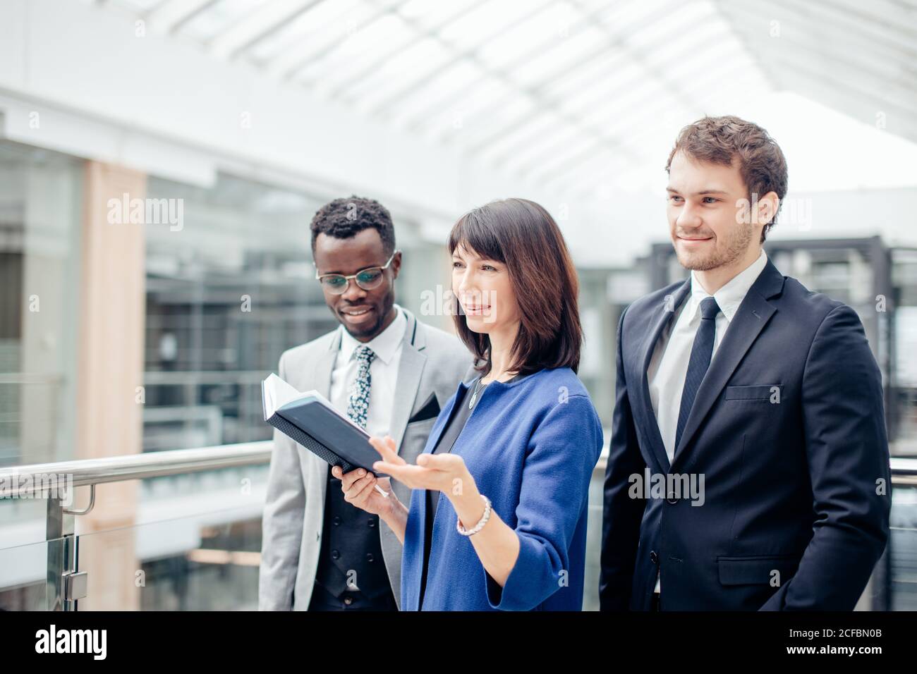 Business partners discussing notes on hi-res stock photography and ...