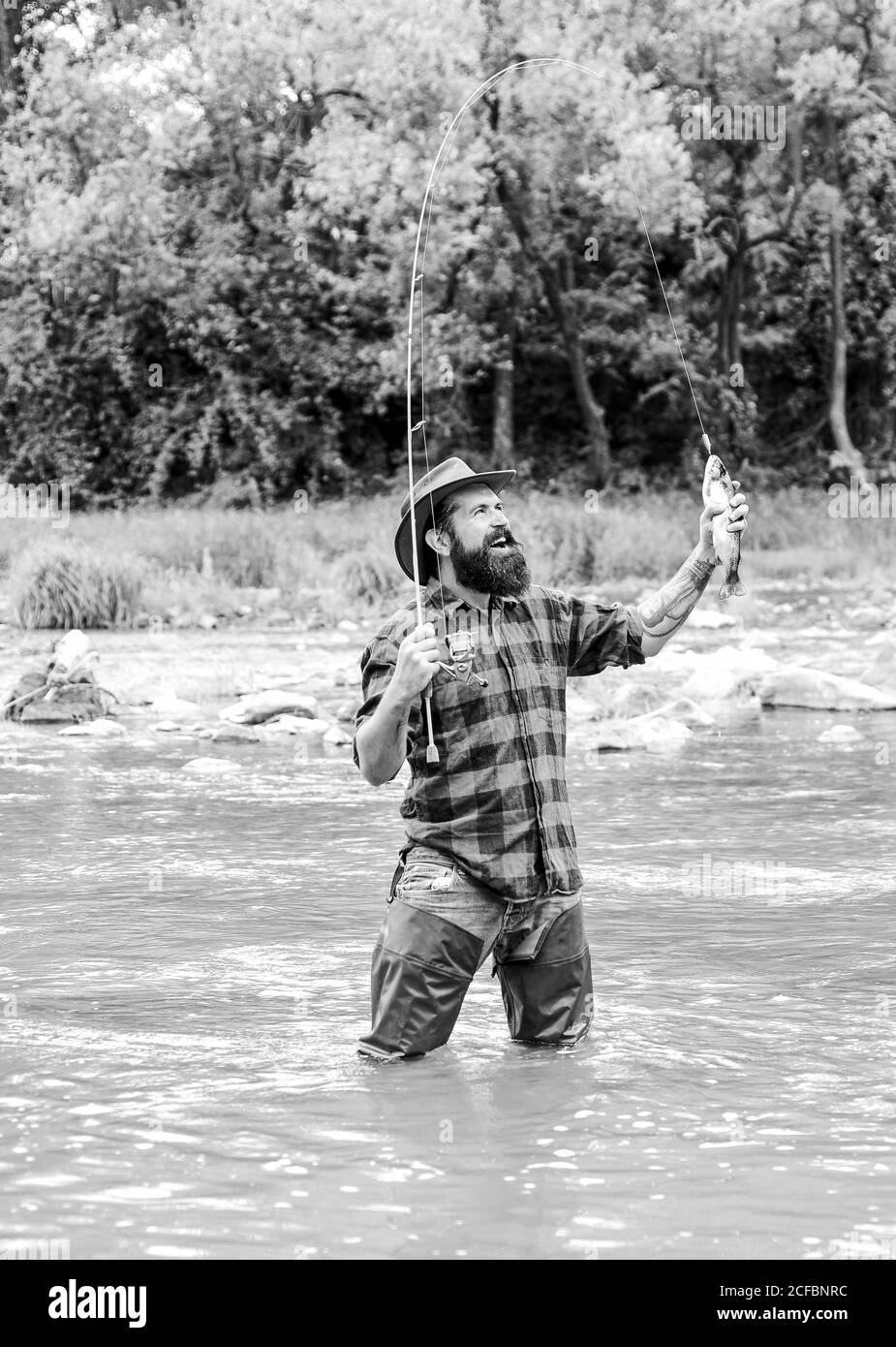 Trendy Hobby Store. bearded fisher in water. mature man fly fishing ...