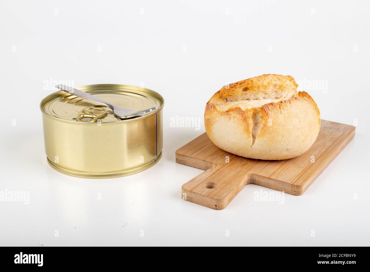 Tasty fresh bun and canned meat. A modest food ration for the prisoner ...