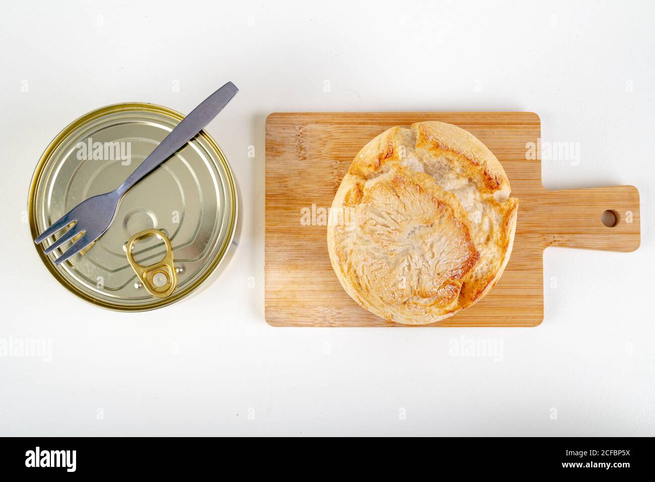 Tasty fresh bun and canned meat. A modest food ration for the prisoner ...