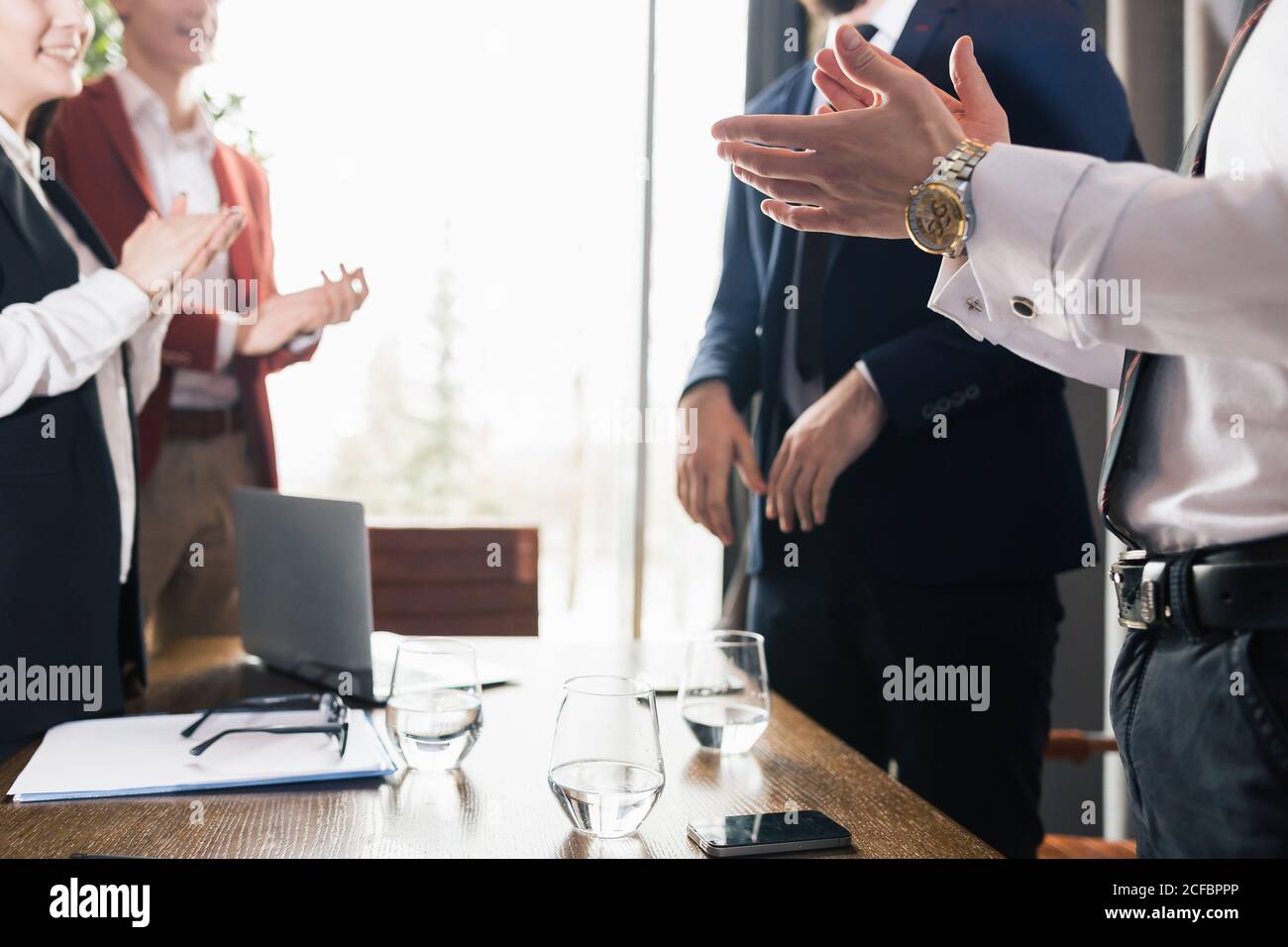 Happy group of businesspeople clapping in office Stock Photo - Alamy