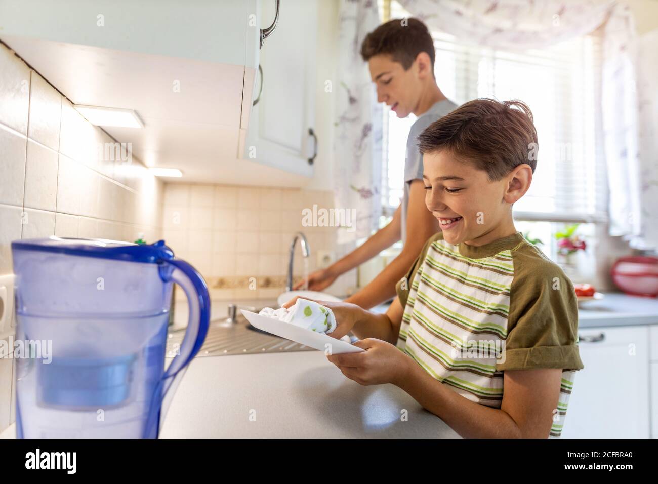 Boy Washing Dishes
