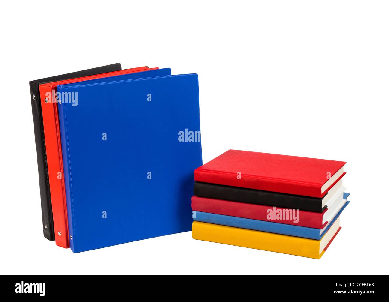Horizontal photo of a stack of books next to some colorful notebooks ...