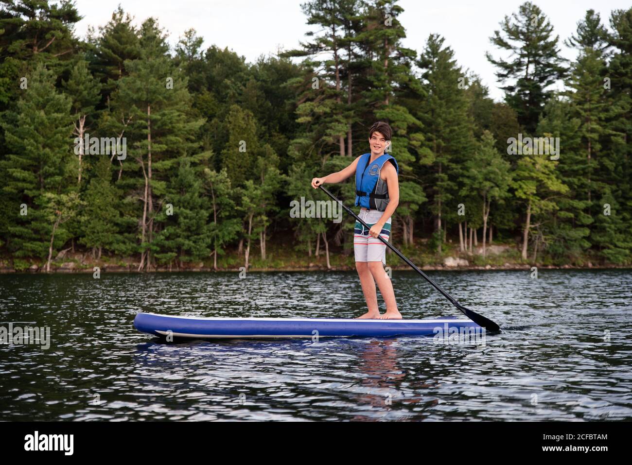 Teen paddling hi-res stock photography and images - Alamy