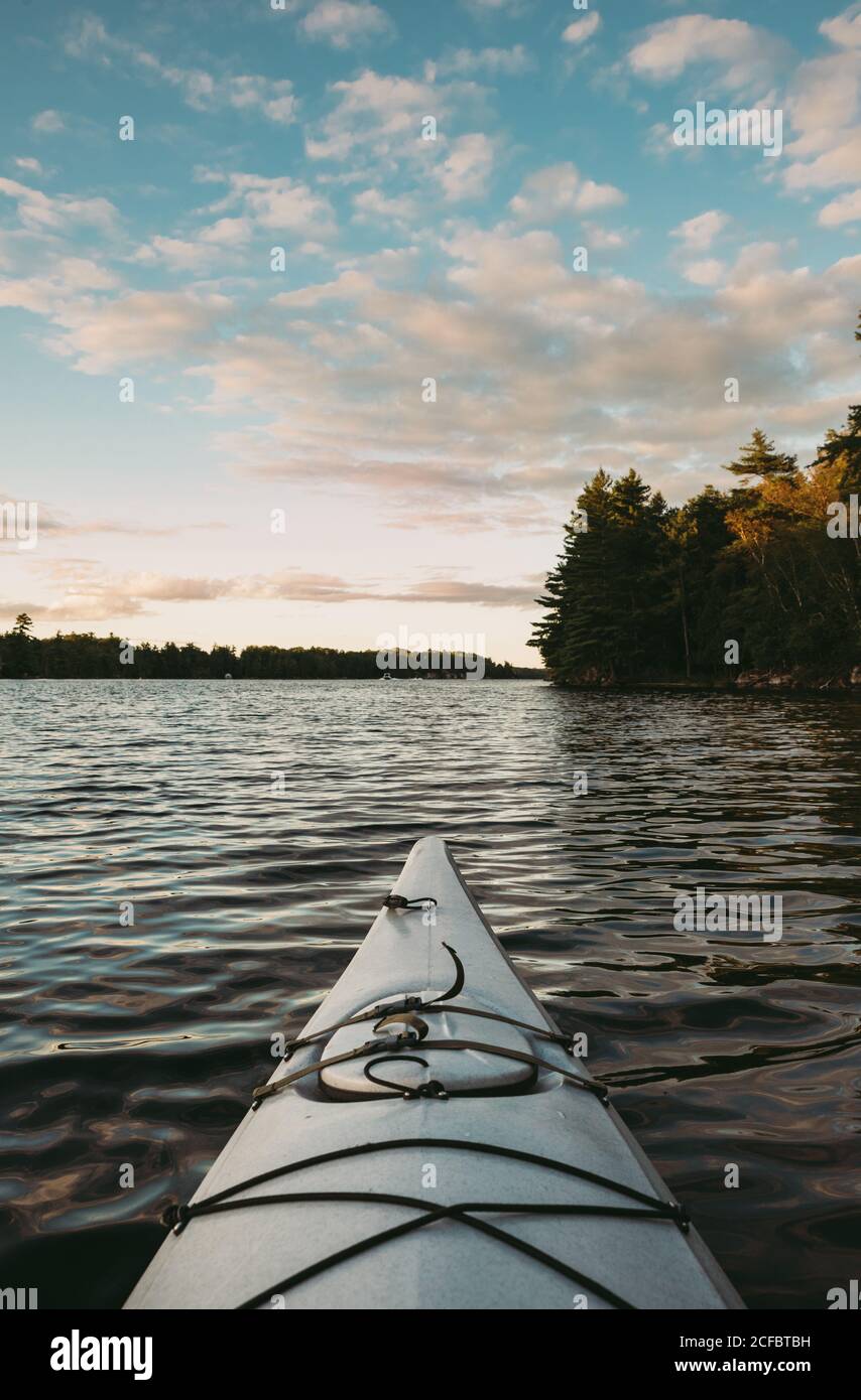 Front of a grey kayak in a lake in Ontario, Canada at sunset Stock ...