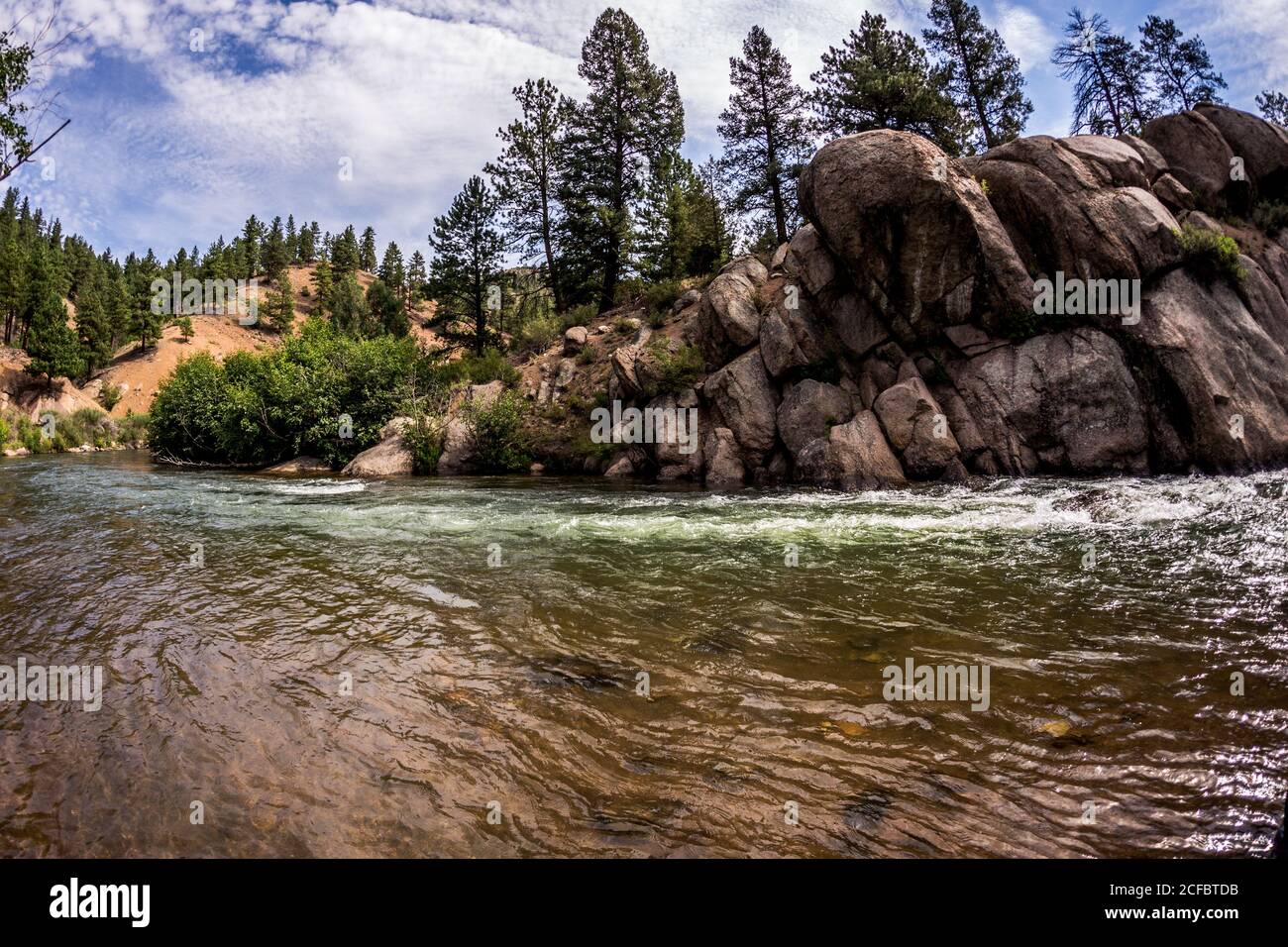 Wide Angle of Colorado River going around a bend with large boulders ...