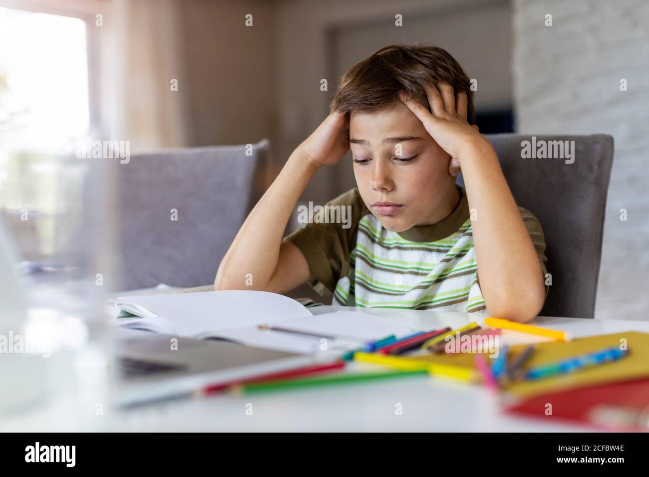 Boy having problems with homework Stock Photo - Alamy