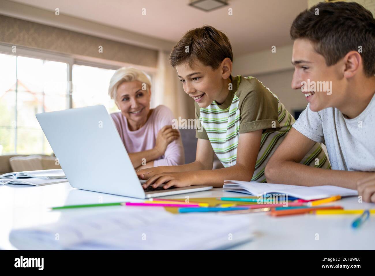 Kids doing homework table hi-res stock photography and images - Alamy