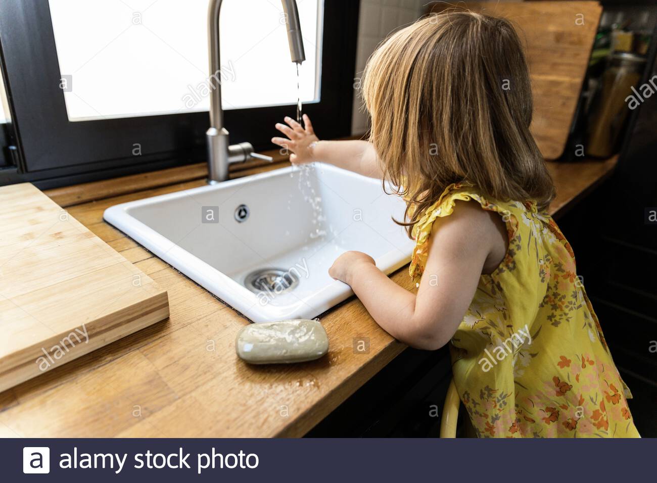 Leaning On Counter High Resolution Stock Photography and Images - Alamy