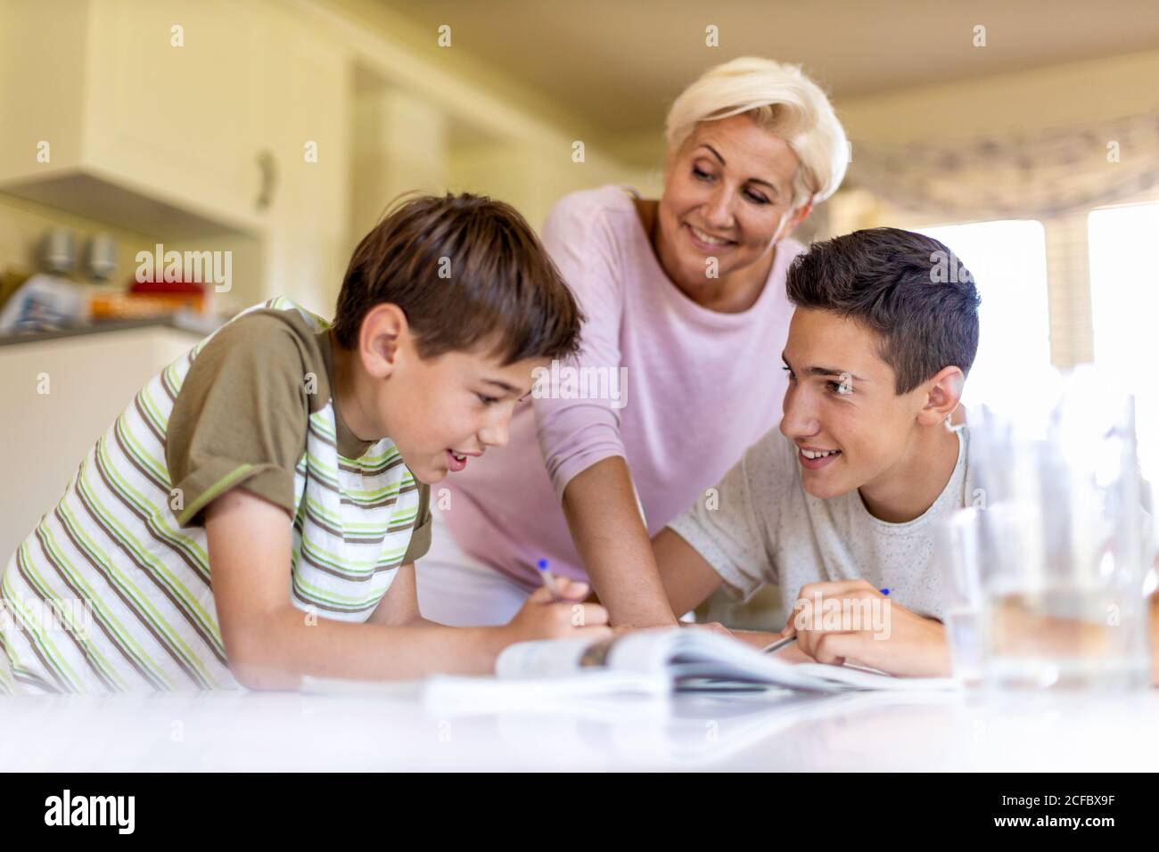 Kids doing homework table hi-res stock photography and images - Alamy