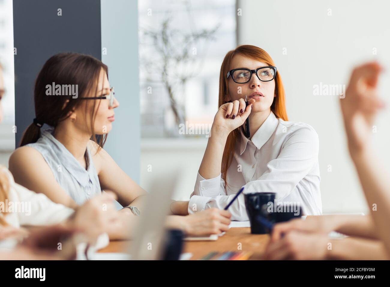 business lady pondering over ideas for new business project Stock Photo ...