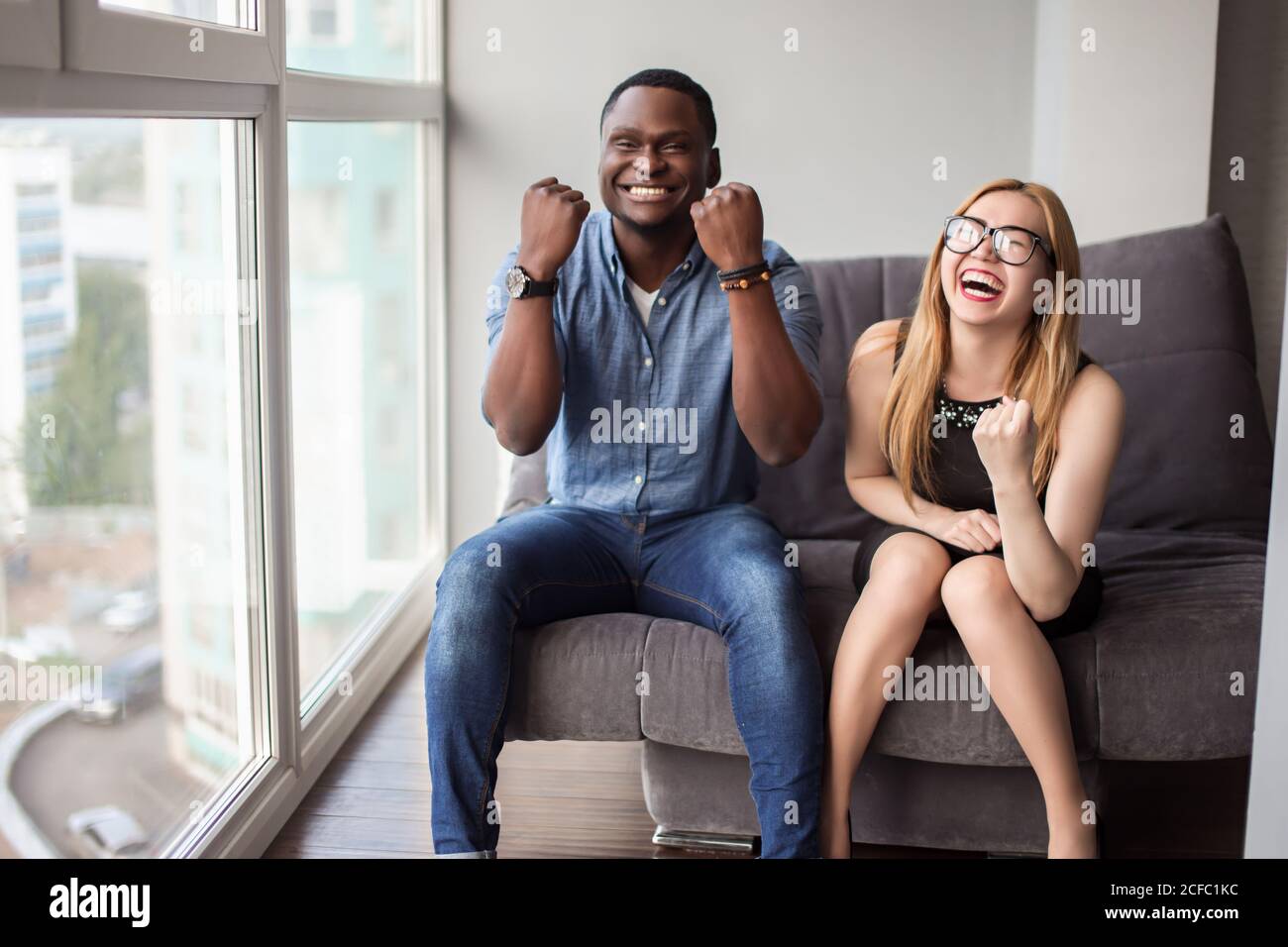 Interracial Couple On Date View Through Cafe Window Afro American Man Using Phone And Asian